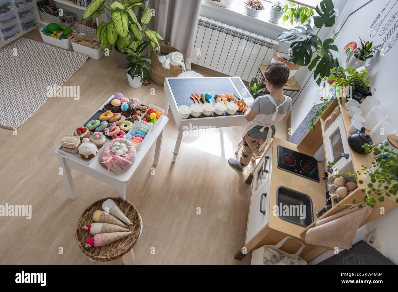 Baby boy playing cafe kitchen cashier payment counting use cash ...