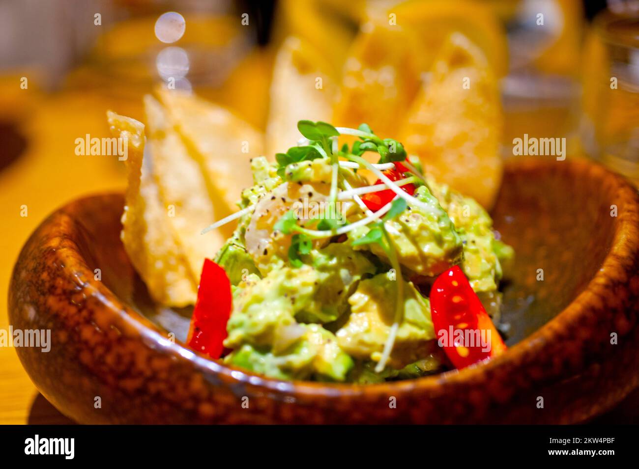 Fresh avocado and shrimps salad with nachos on side Stock Photo - Alamy