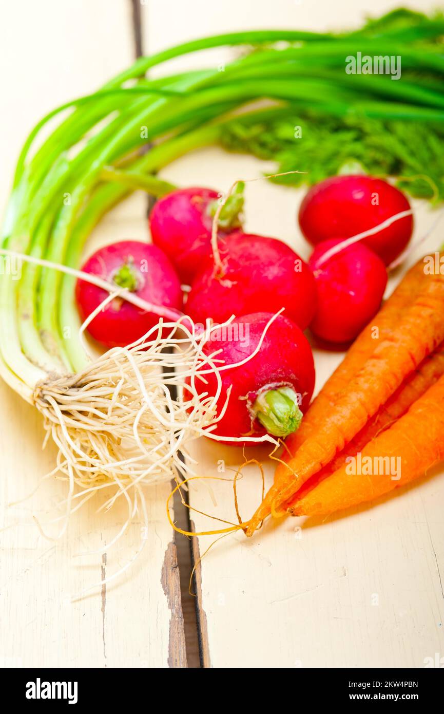 Raw root vegetable on a rustic white wood table Stock Photo - Alamy