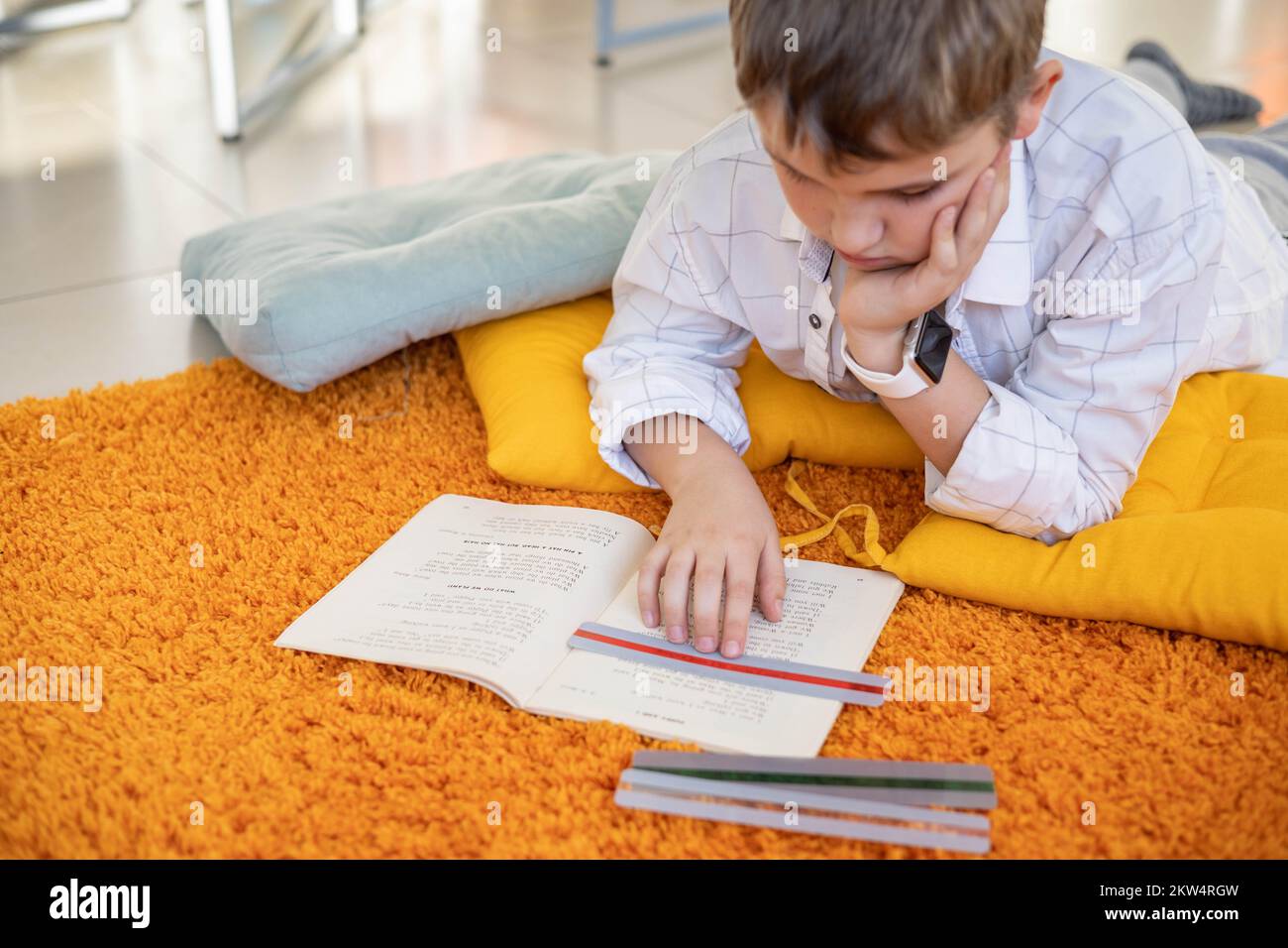 Khabarovsk, Russia, October 28, 2022. Dyslexic child reading book ...
