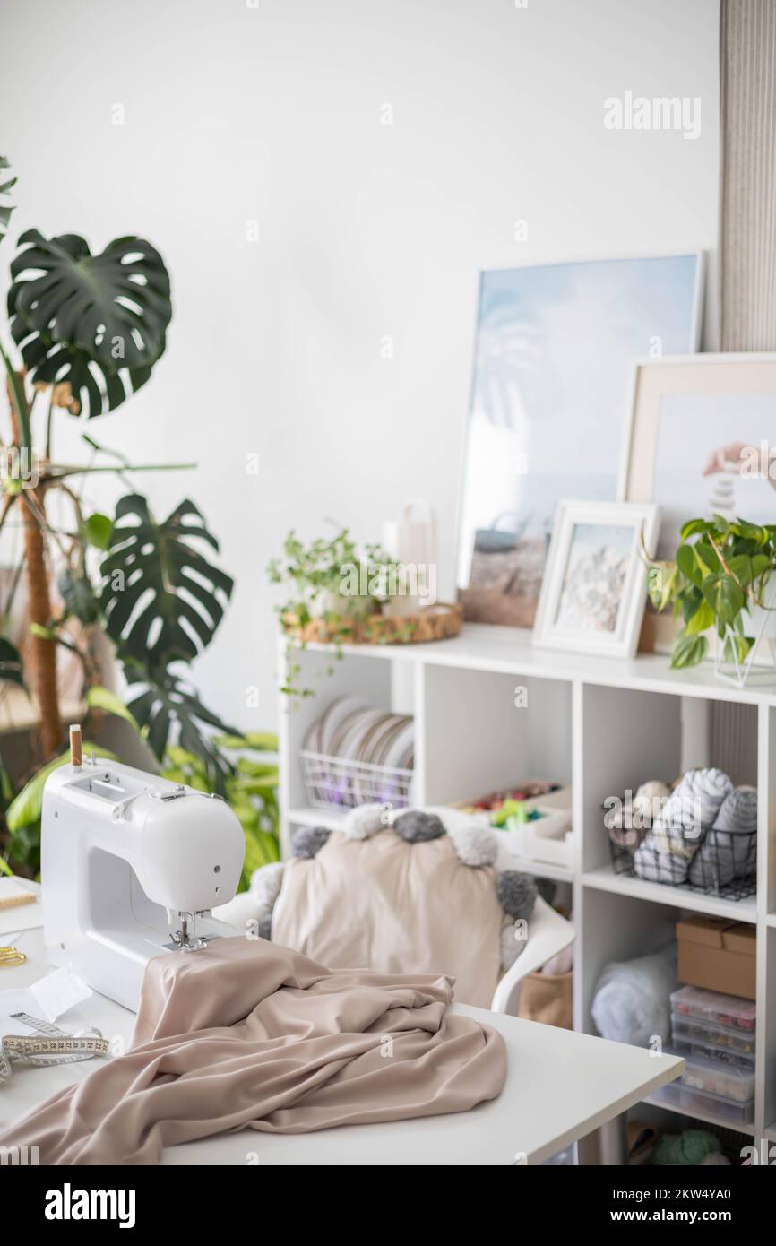 Modern workplace of tailor textile craft designer table with sewing ...