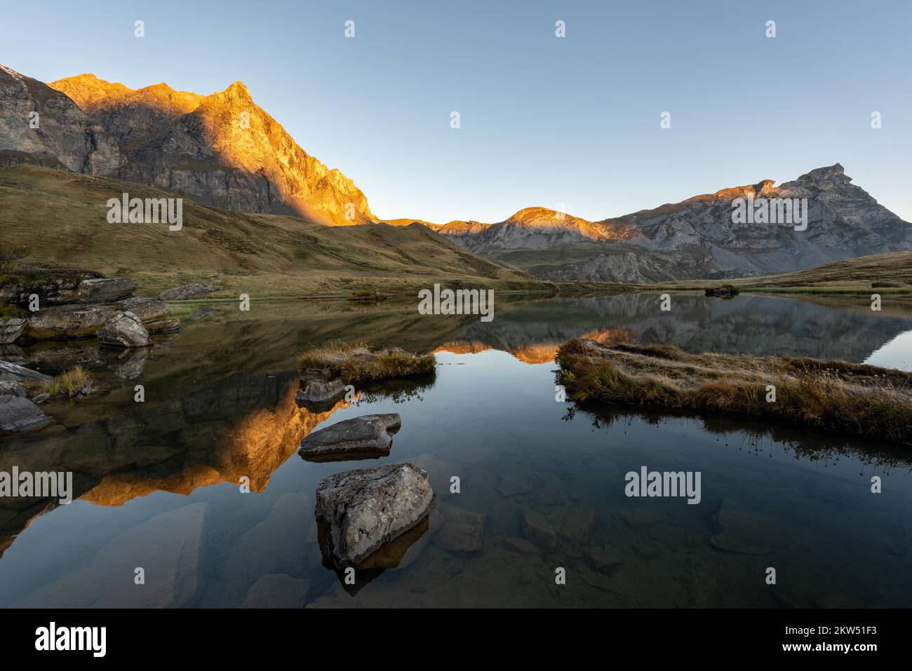 The Blue Lake at sunrise near Melchsee-Frutt on the Aa Alp in the Melch ...