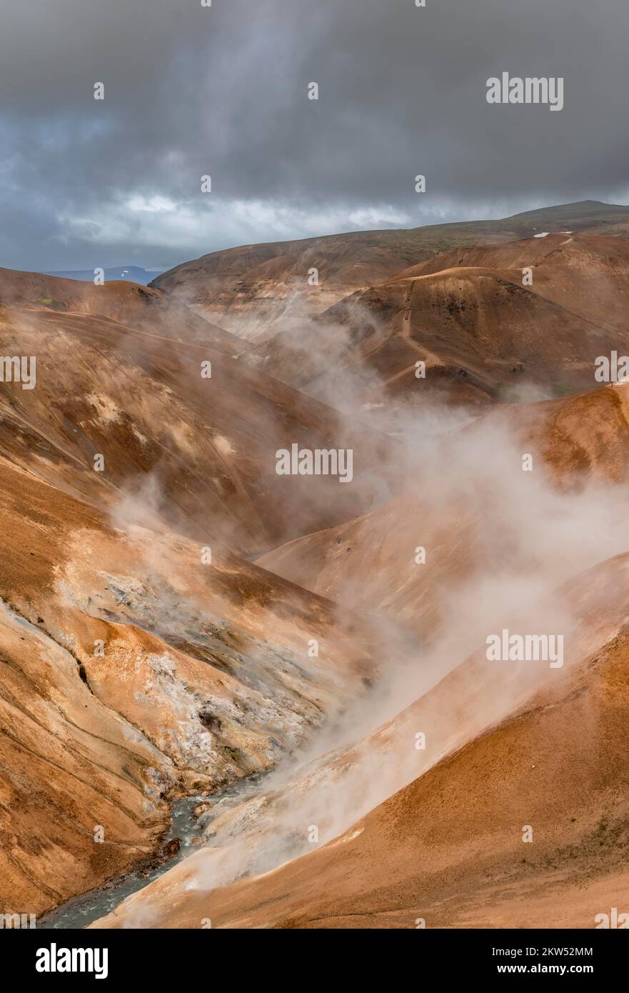 Steaming stream between colourful rhyolite mountains, Hveradalir ...