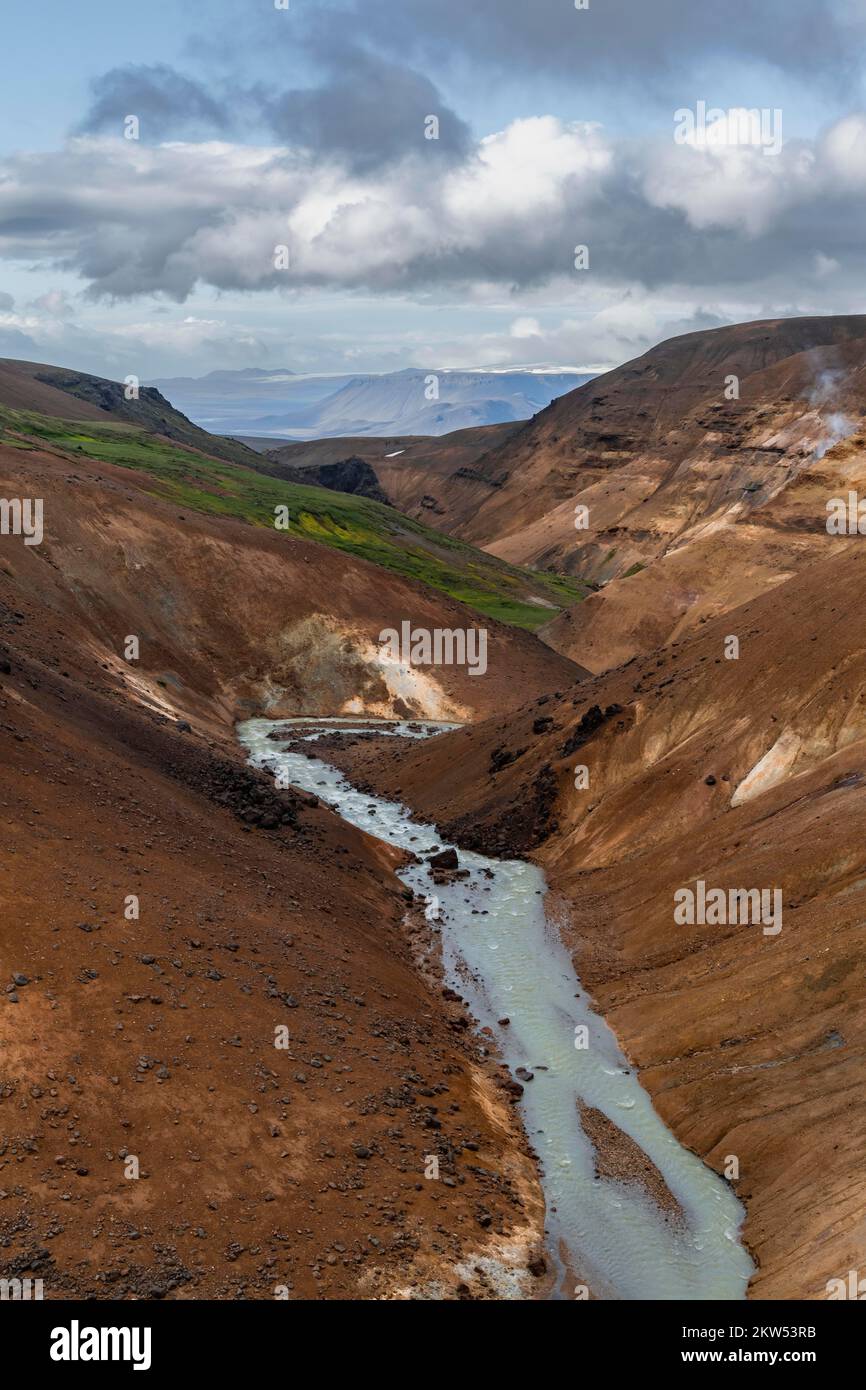 Stream between colourful rhyolite mountains, Hveradalir geothermal area ...