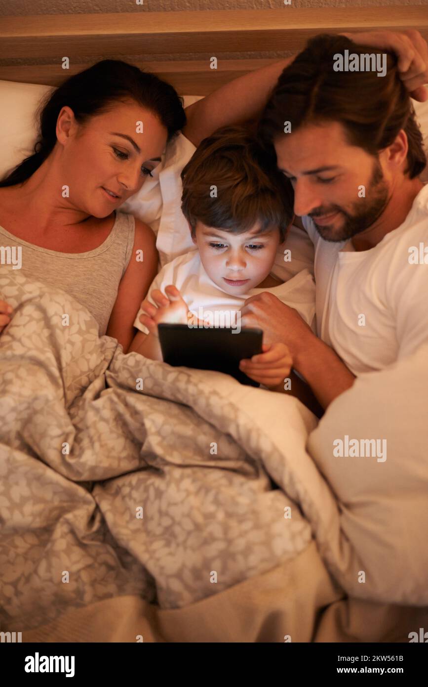 Storytime in the modern age. A shot of a little boy using a tablet ...