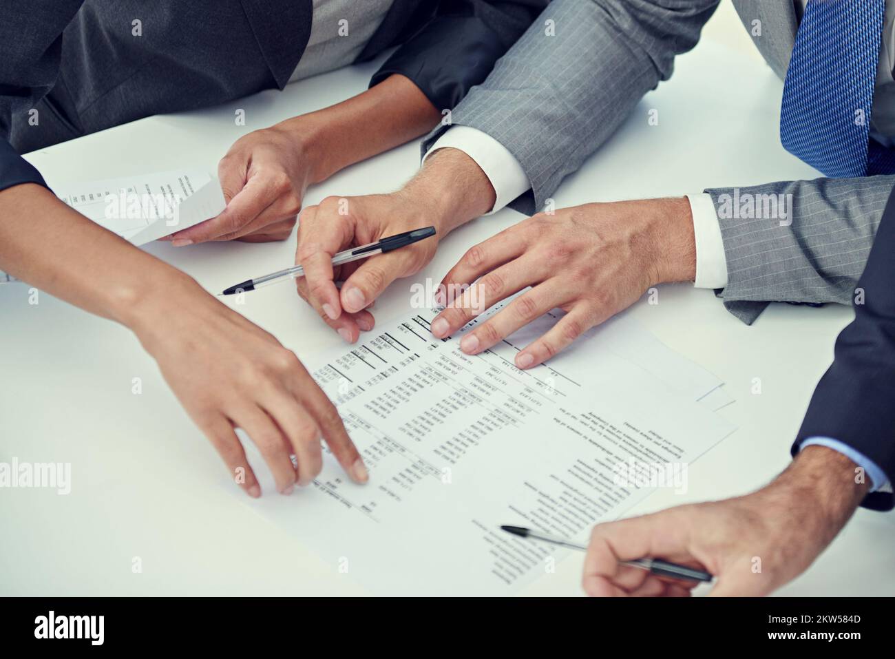 Financial gurus at work. a group of businesspeople reviewing financial ...