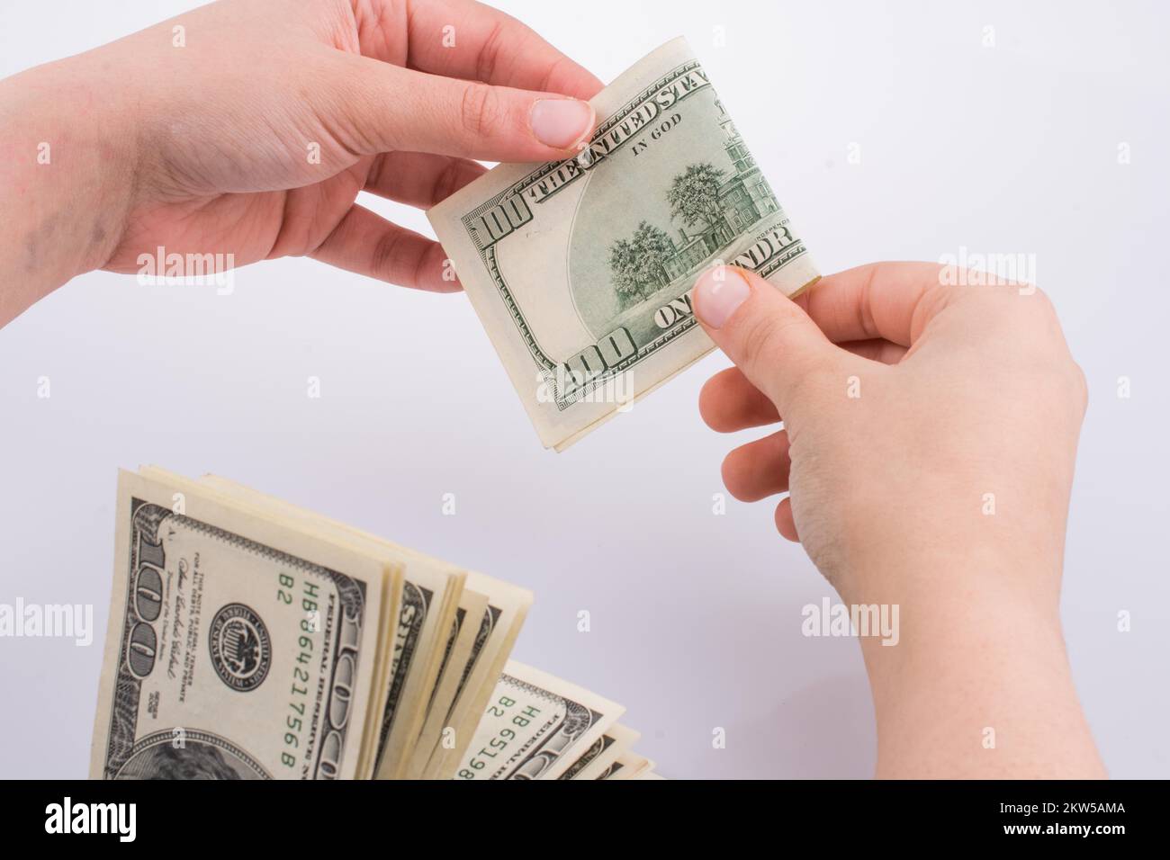 Human hand holding American dollar bill as money isolated on white ...