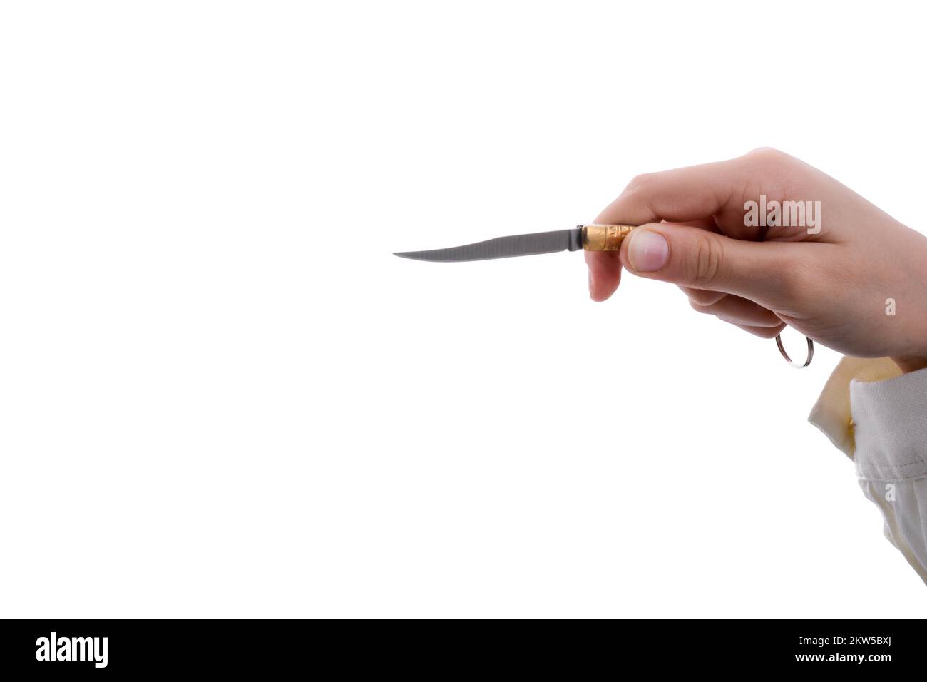 Hand holding a knife in hand on a white background Stock Photo - Alamy