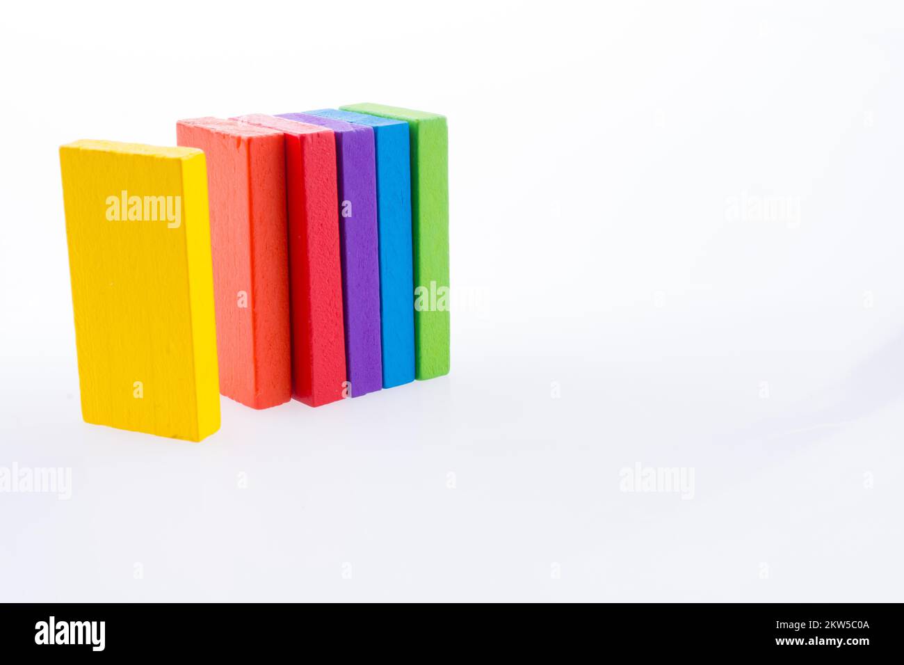 Color dominoes on a white background Stock Photo - Alamy