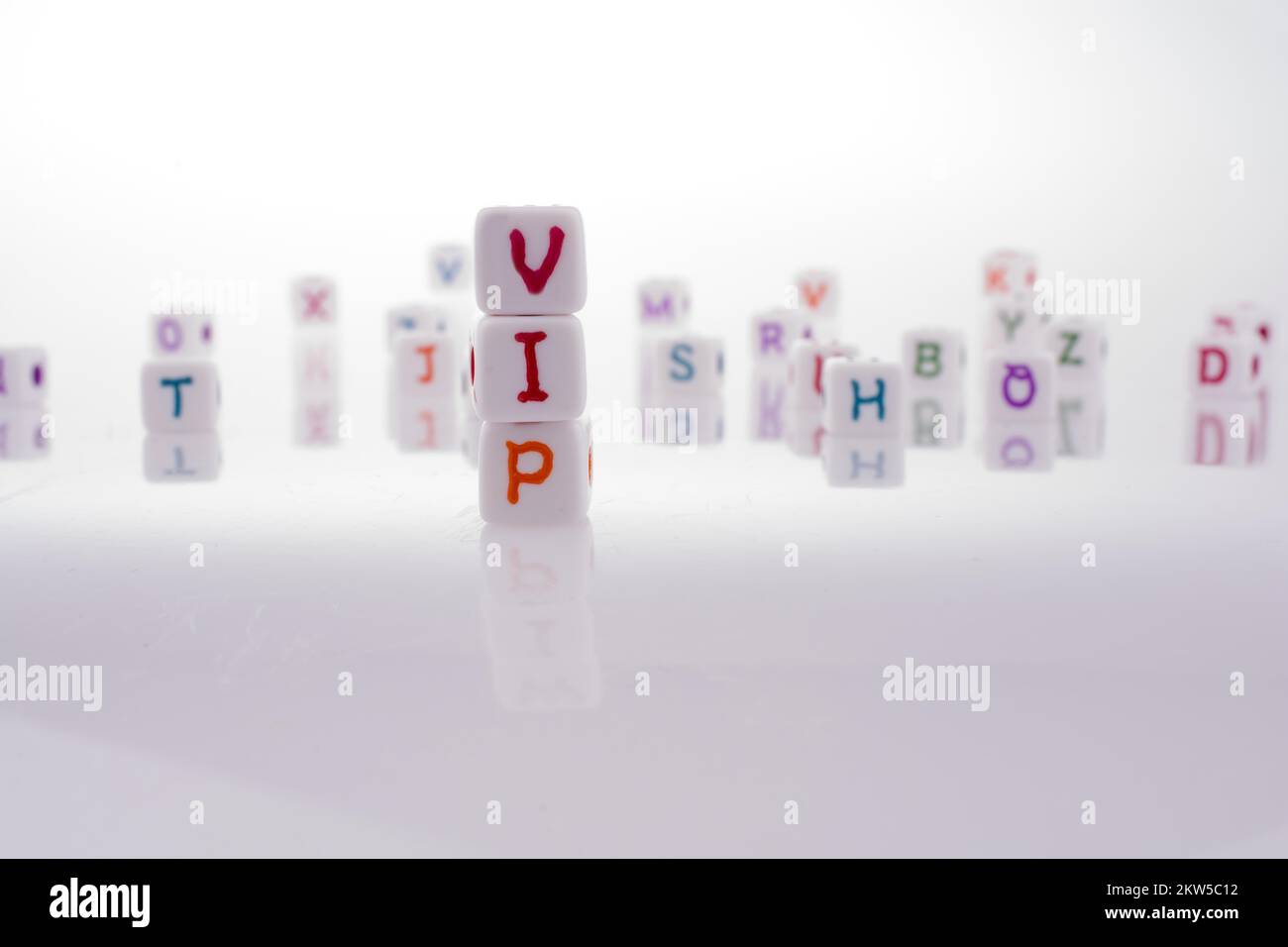 Alphabet blocks and the word VIP on a white background Stock Photo - Alamy