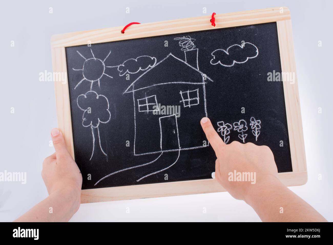 Hand drawing a house on the blackboard with a chalk Stock Photo - Alamy