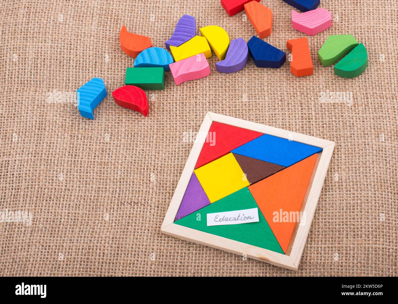 Colorful pieces of a square tangram puzzle Stock Photo - Alamy