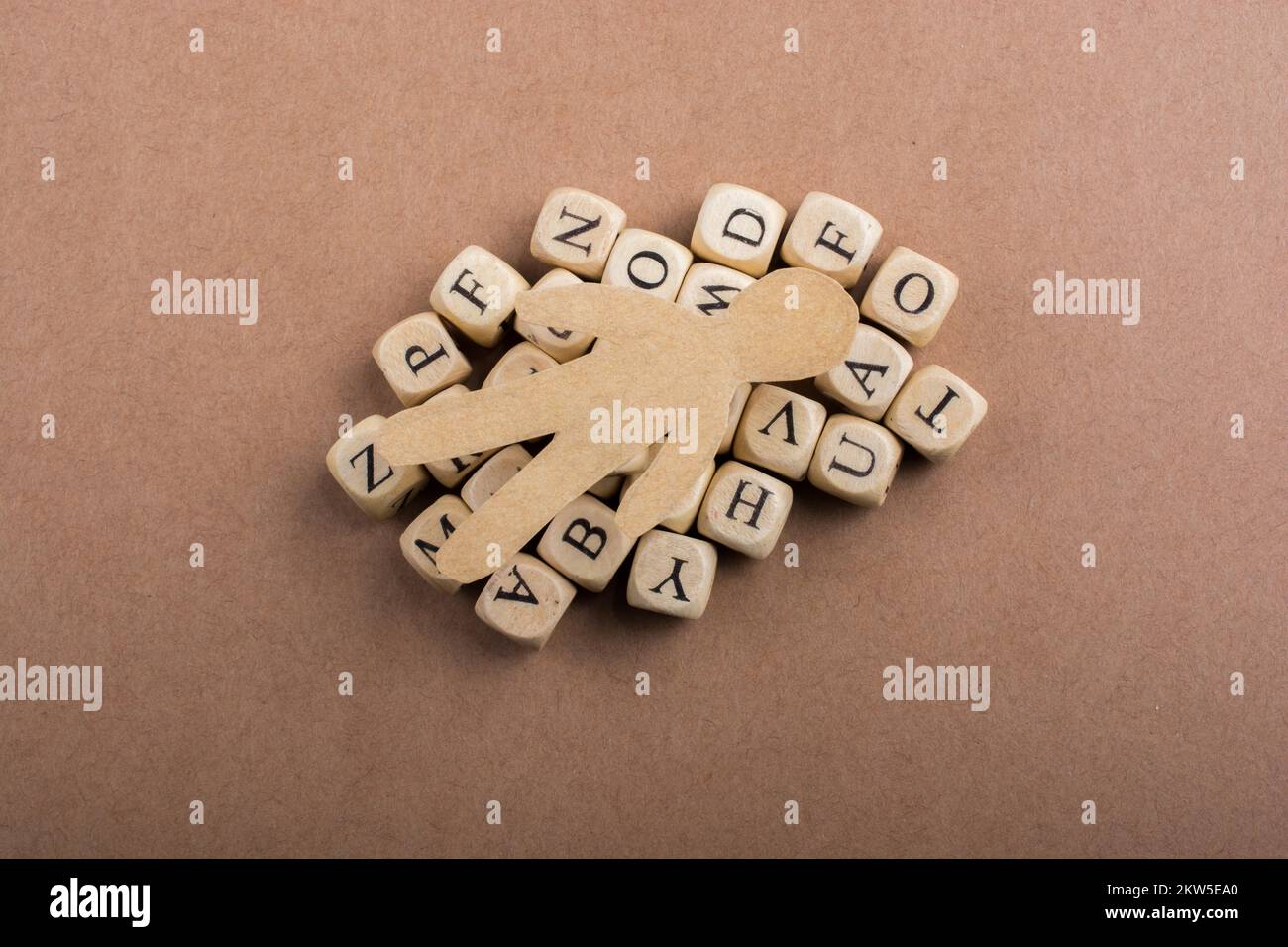 Paper man and letter cubes of made of wood Stock Photo - Alamy