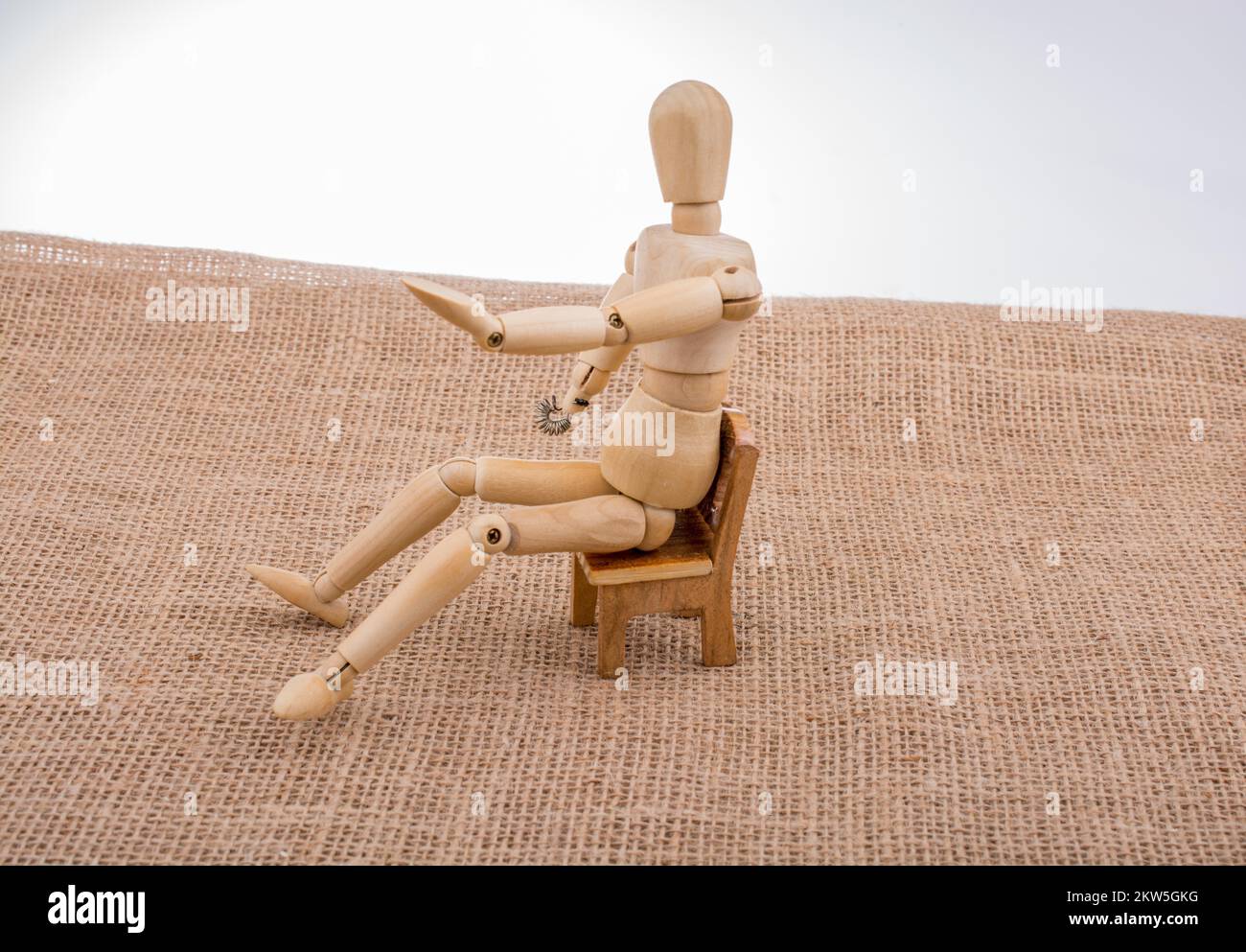 Little man figurine made of wood in view Stock Photo - Alamy