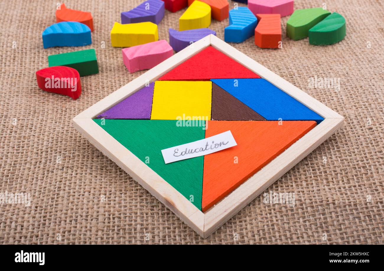 Colorful pieces of a square tangram puzzle Stock Photo - Alamy