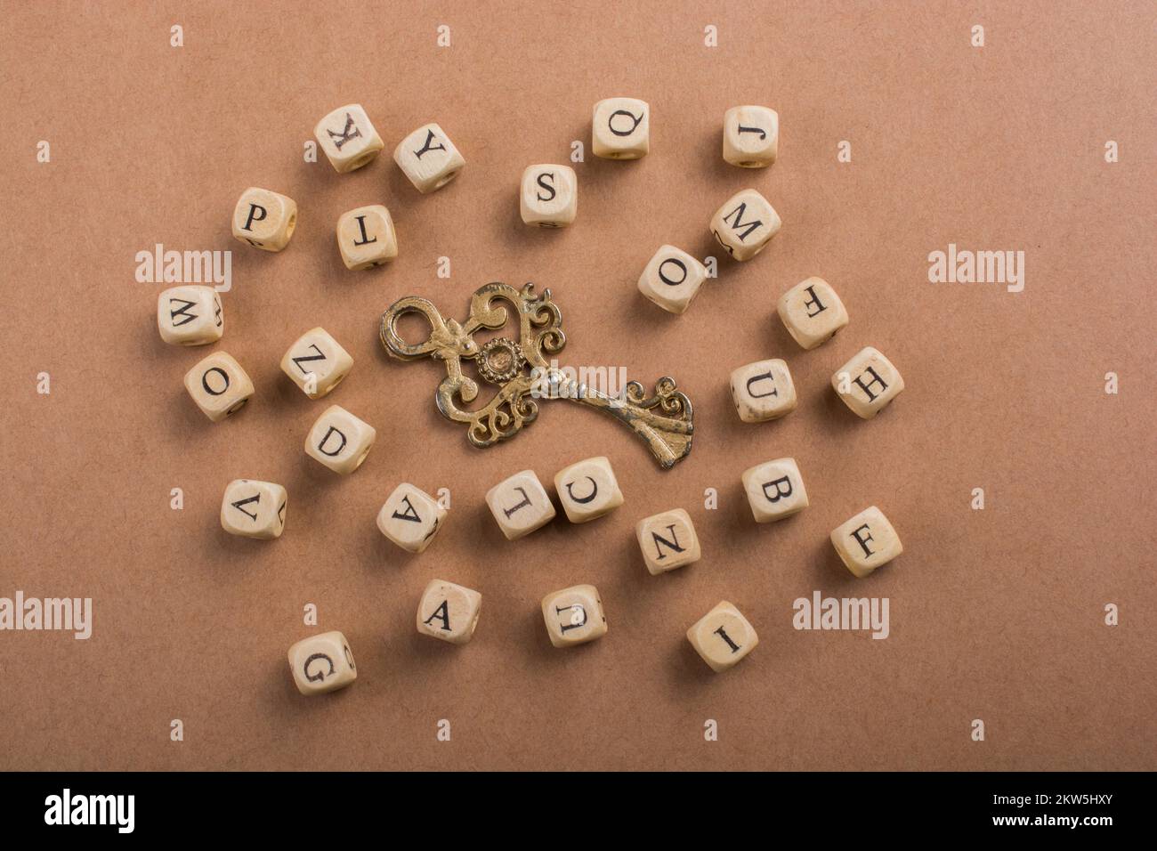 Letter cubes of made of wood around retro key Stock Photo - Alamy
