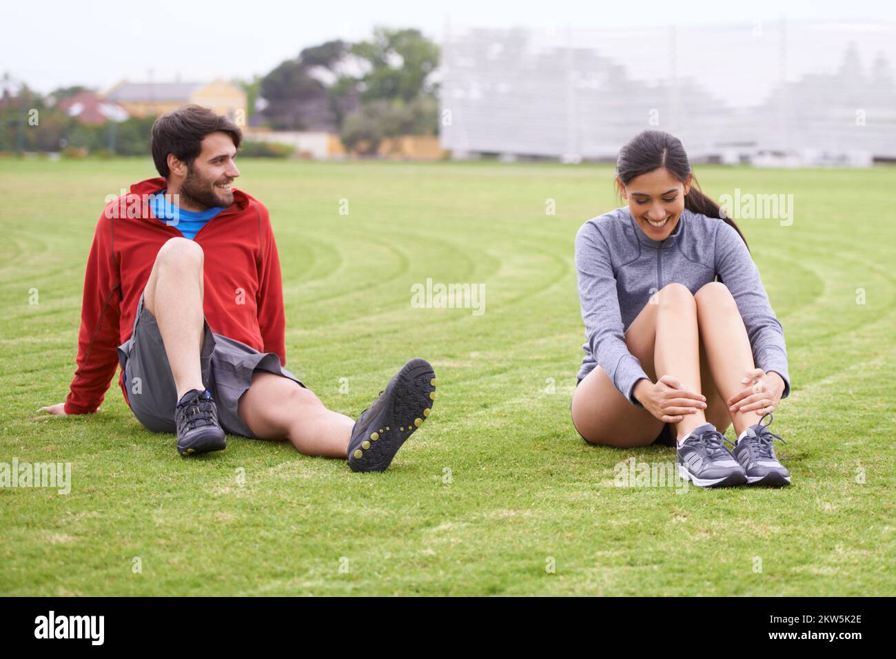 Staying in shape together. a young couple exercising outdoors Stock ...