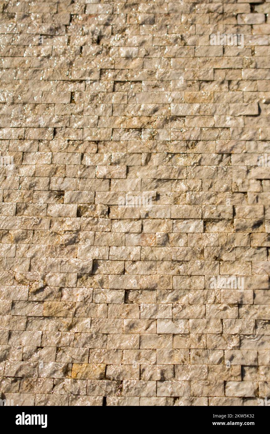Decorative stone background built of little stones Stock Photo - Alamy