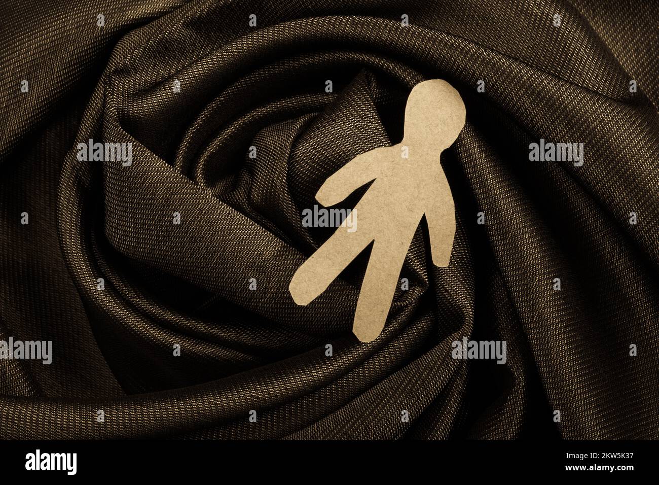 Man shape cut out of paper in hand in the view Stock Photo - Alamy