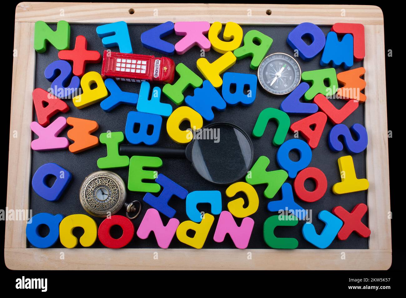 Magnifying glass and Colorful Letters of Alphabet Stock Photo - Alamy