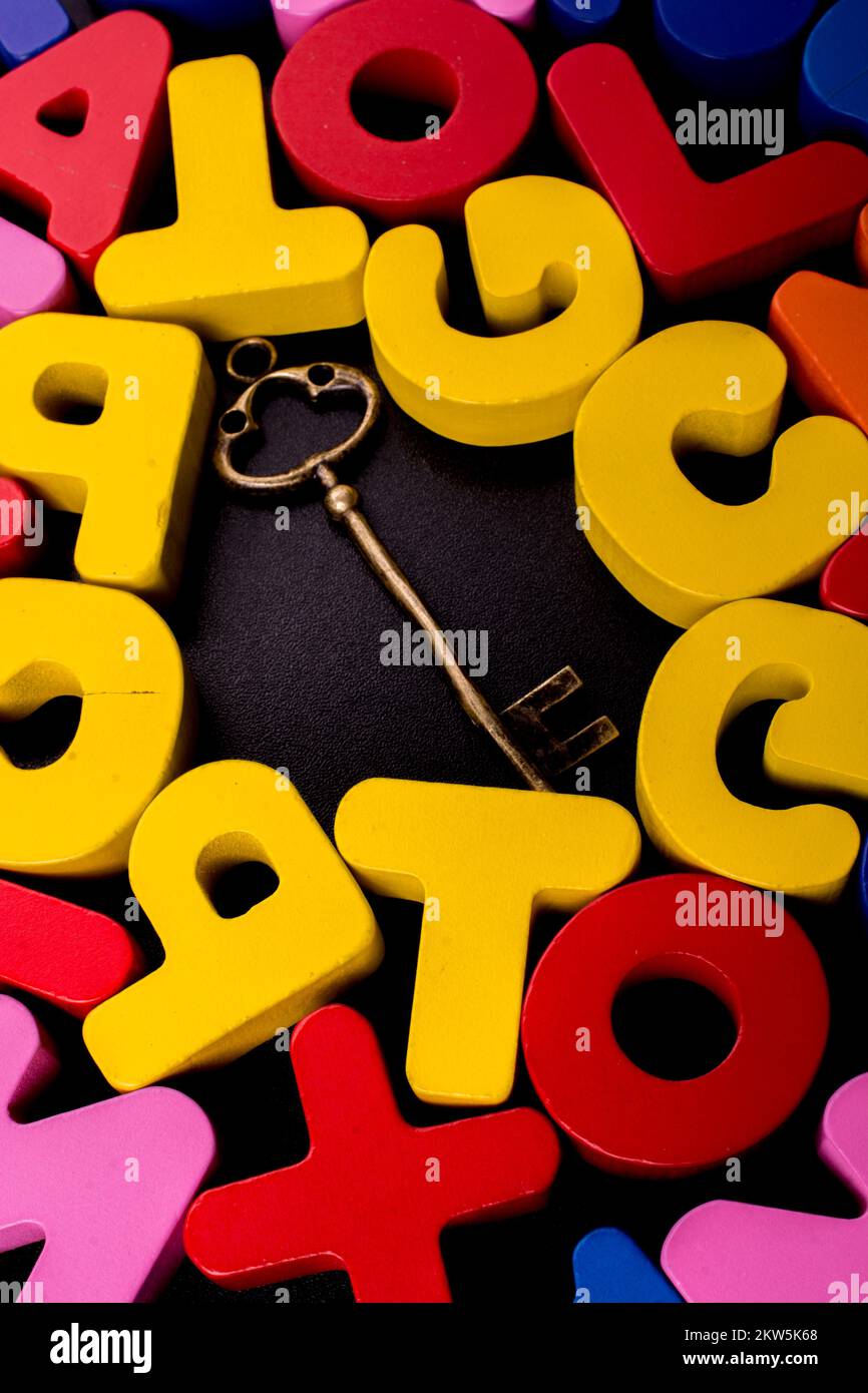Retro key and Colorful Letters of Alphabet made of wood Stock Photo - Alamy