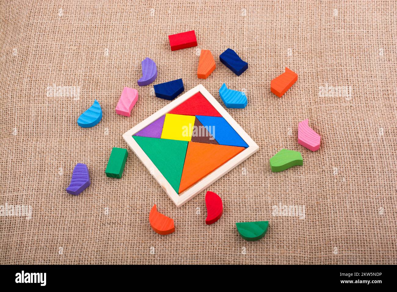 Colorful pieces of a square tangram puzzle Stock Photo - Alamy
