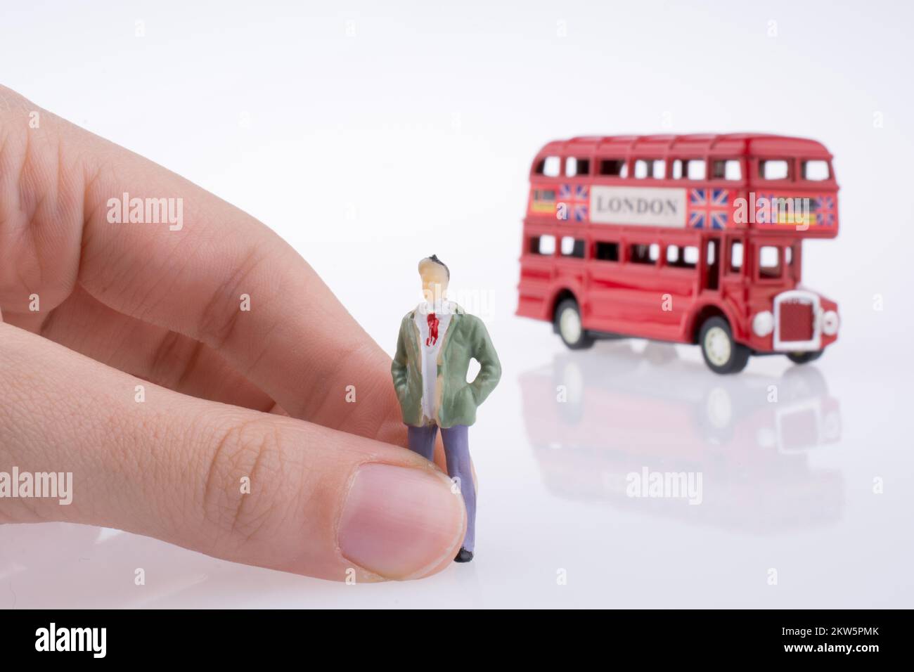 Human figure near a London Bus on a white background Stock Photo - Alamy