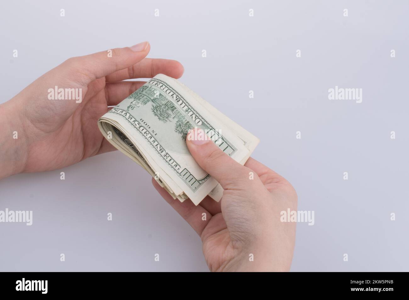 Human hand holding American dollar bill as money isolated on white ...