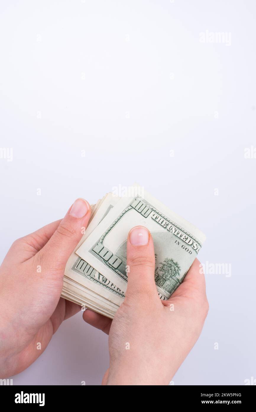 Human hand holding American dollar bill as money isolated on white ...