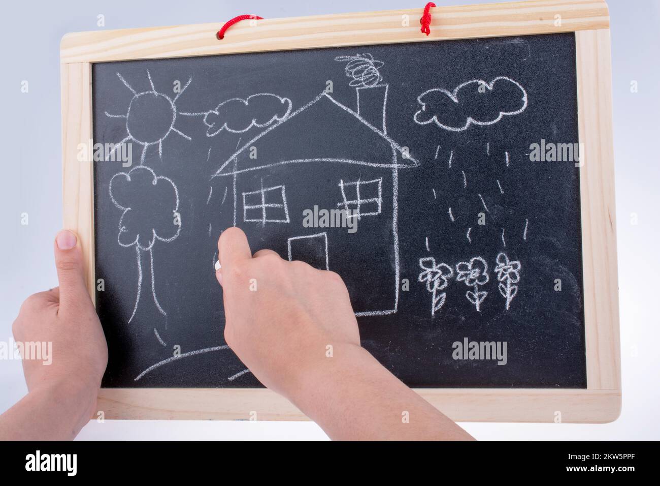 Hand drawing a house on the blackboard with a chalk Stock Photo - Alamy