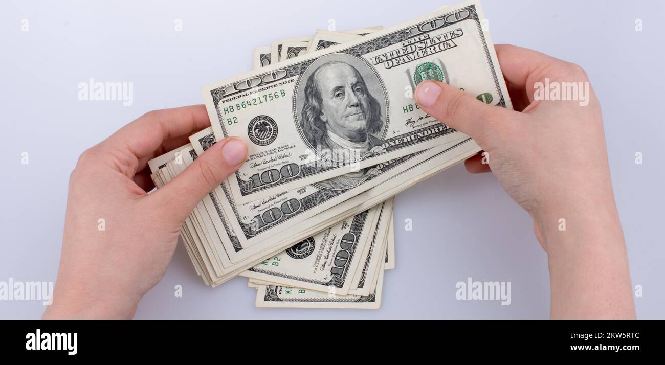 Human hand holding American dollar bill as money isolated on white ...
