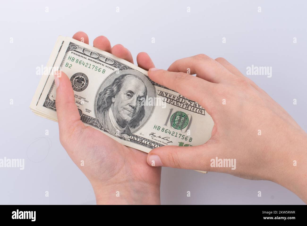 Human hand holding American dollar bill as money isolated on white ...