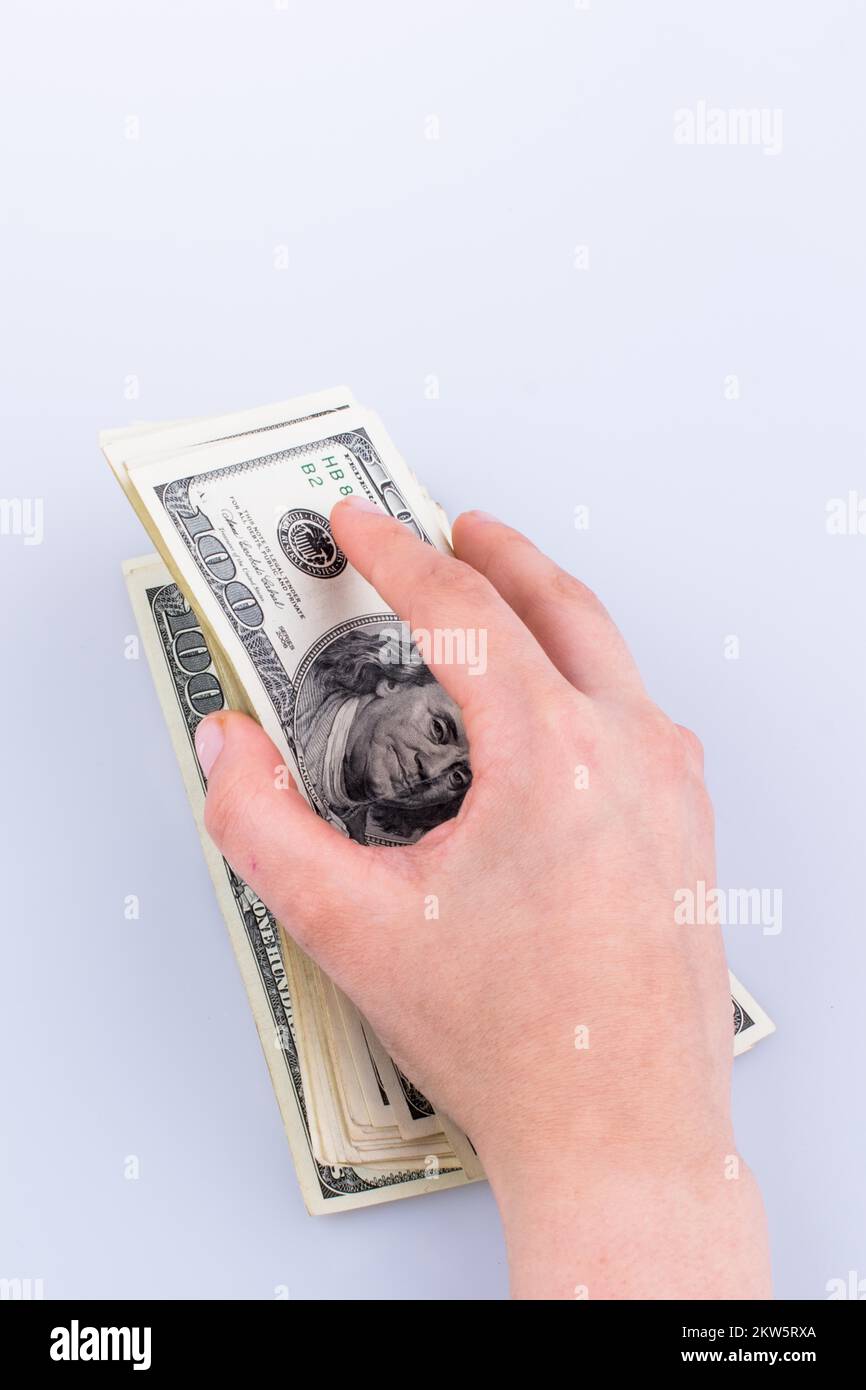 Human hand holding American dollar bill as money isolated on white ...