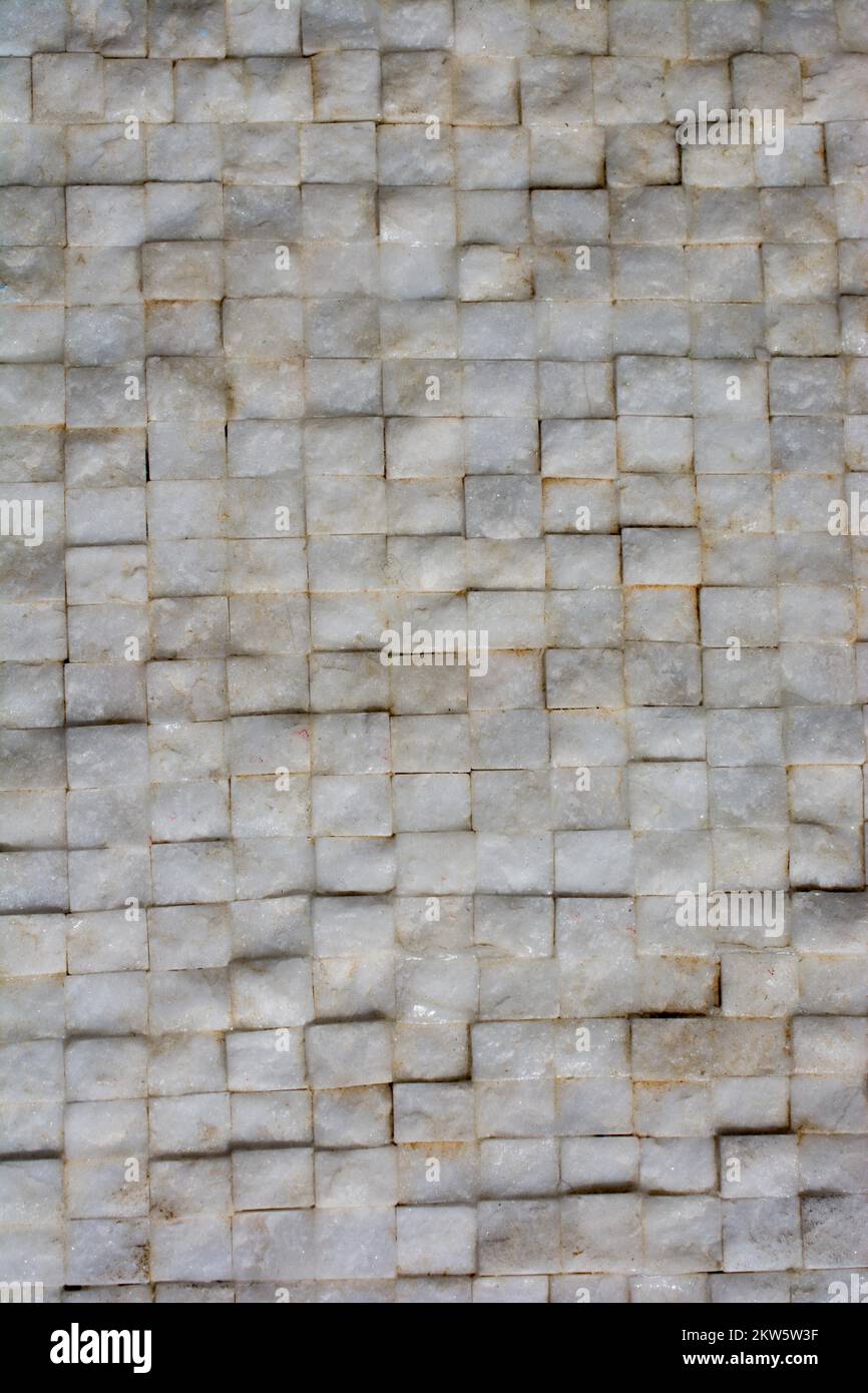Decorative cubic stone wall as background texture Stock Photo - Alamy
