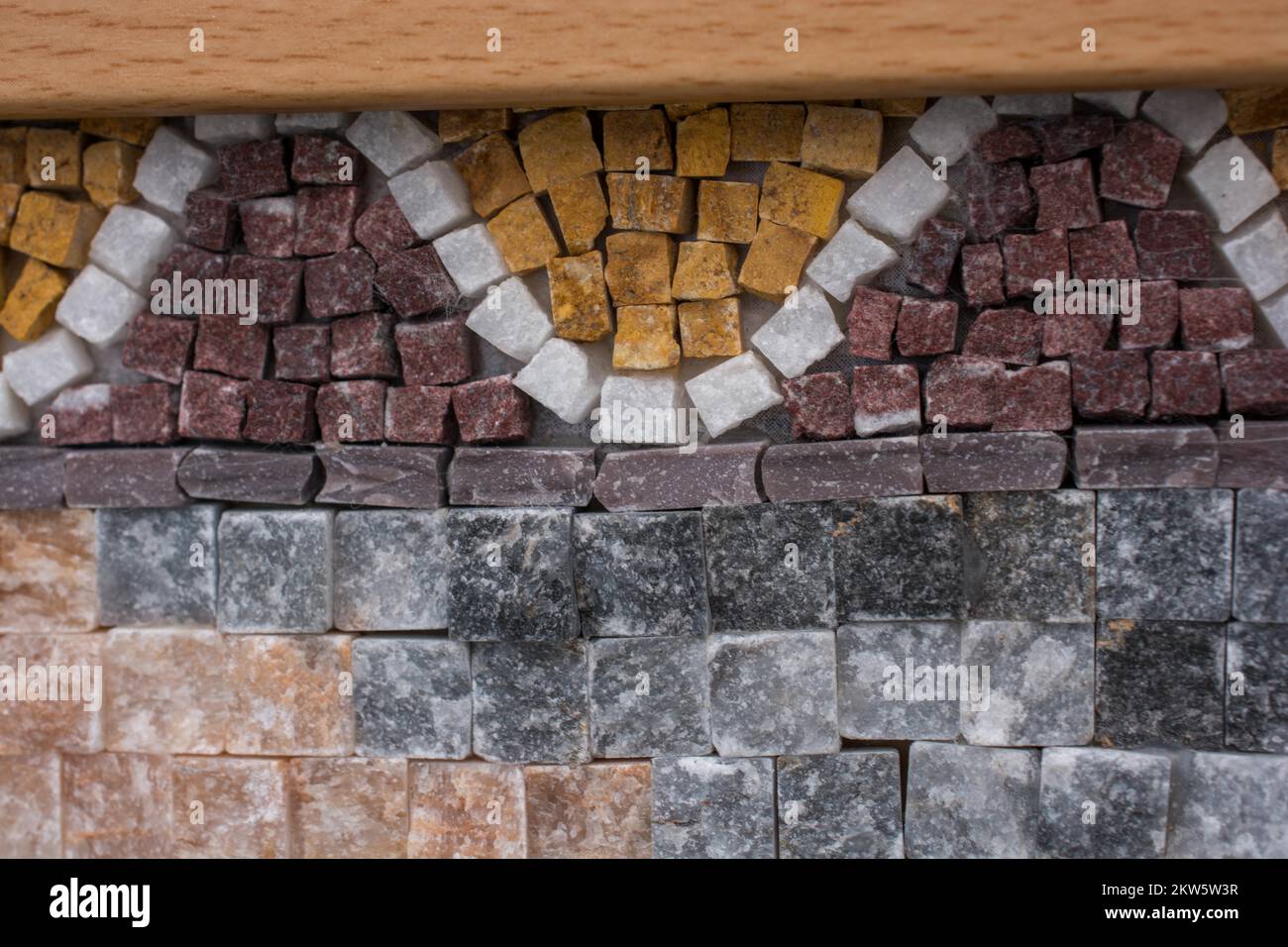 Decorative stone background built of little stones Stock Photo - Alamy