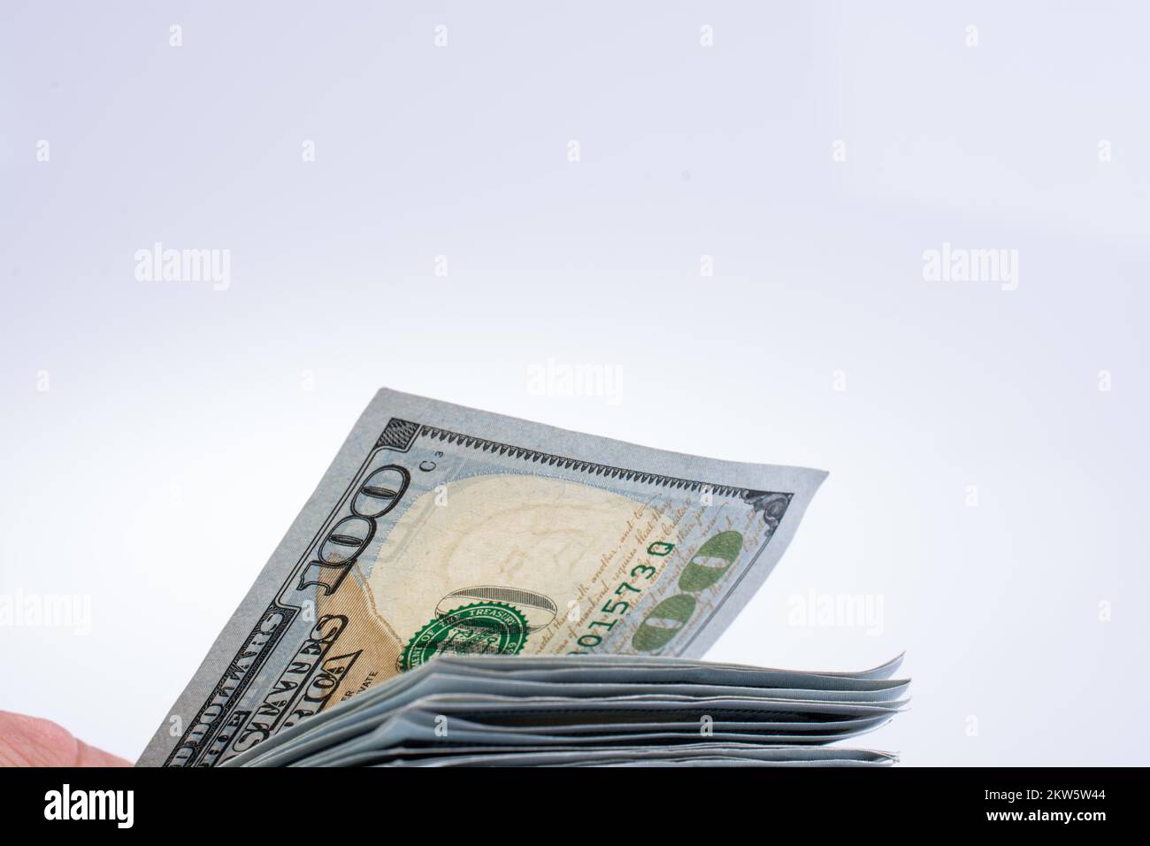 American 100 dollar banknotes made of paper placed on white background ...