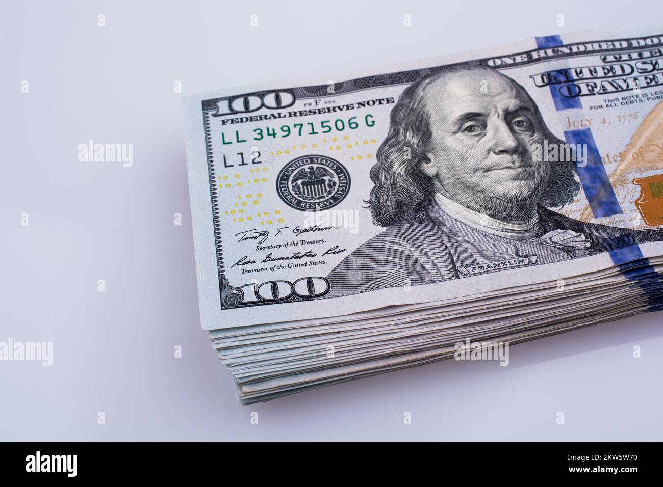 American 100 dollar banknotes made of paper placed on white background ...
