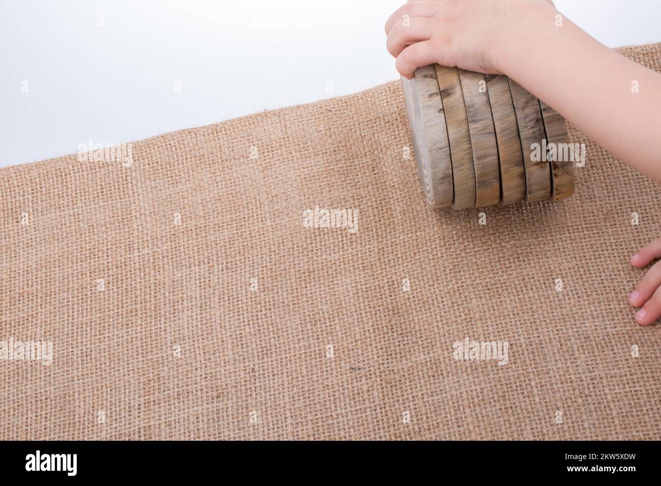 Wood Log cut in round thin pieces in hand Stock Photo - Alamy