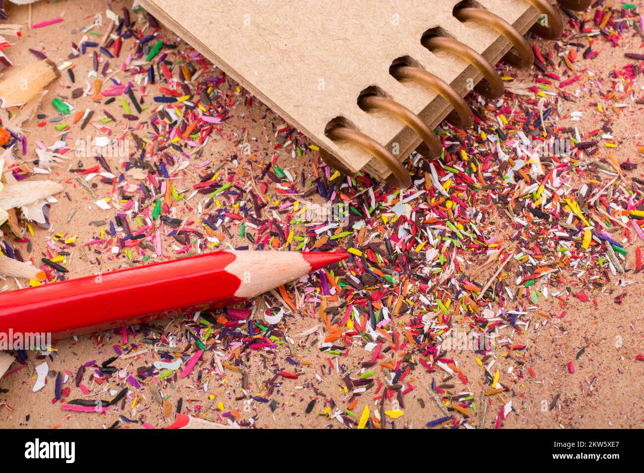 Red Color Pencil over some pencil shavings Stock Photo - Alamy
