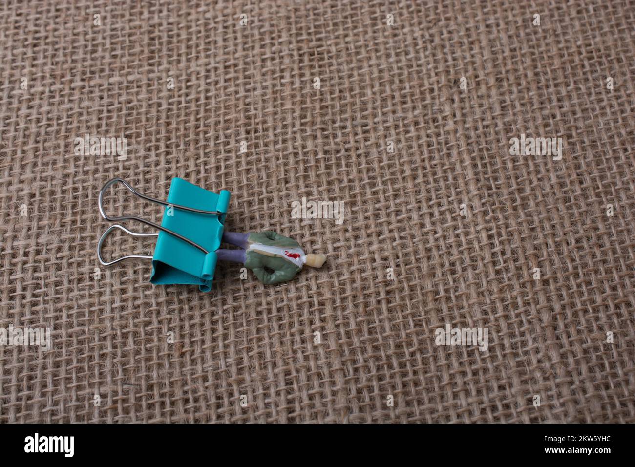 Colorful clip placed on a linen canvas Stock Photo - Alamy