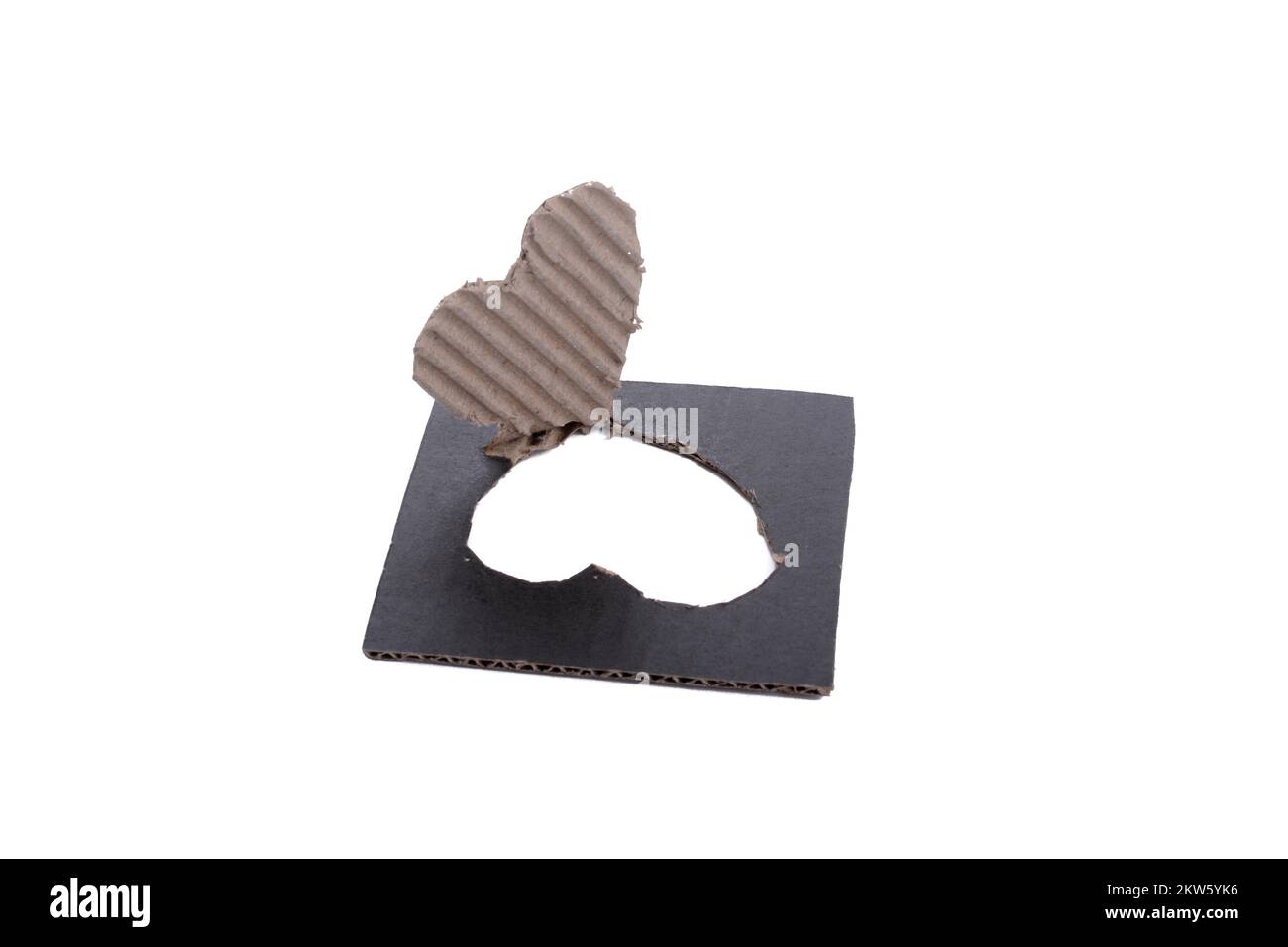 Heart shape cut out of a cardboard paper Stock Photo - Alamy
