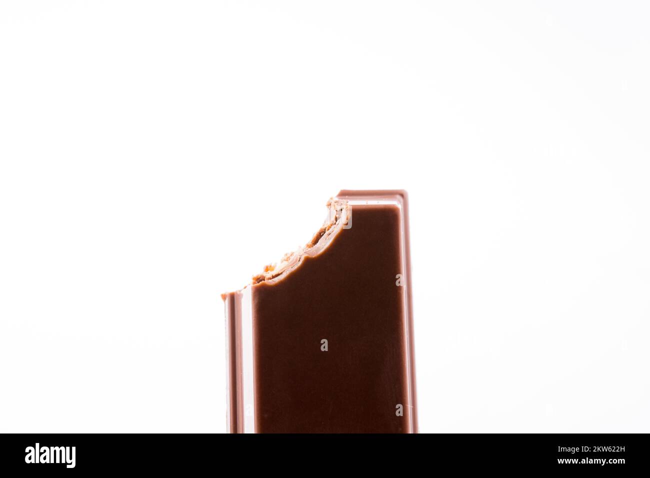 Bitten Chocolate bar on a white background Stock Photo - Alamy