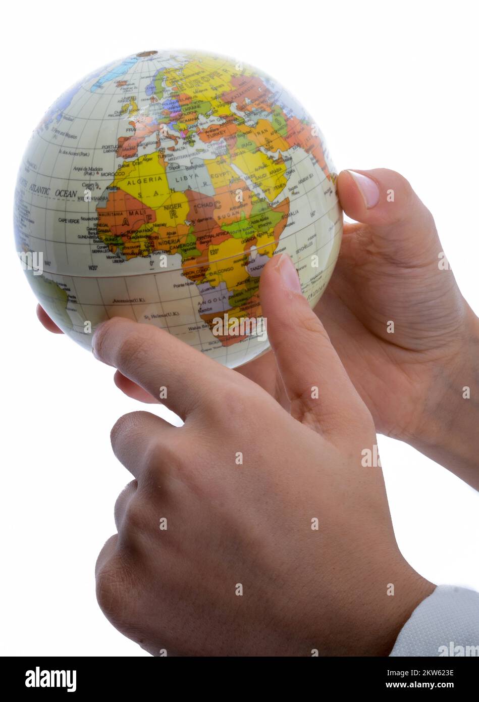 Child holding a small globe in hand on white background Stock Photo - Alamy