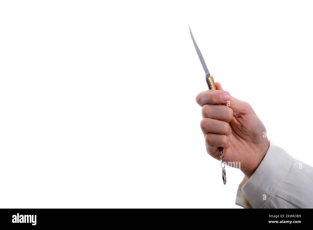 Hand holding a knife in hand on a white background Stock Photo - Alamy