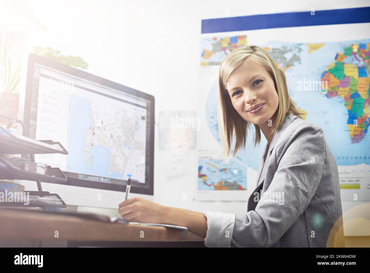 Let me plan your holiday. Cropped portrait of a young female travel ...