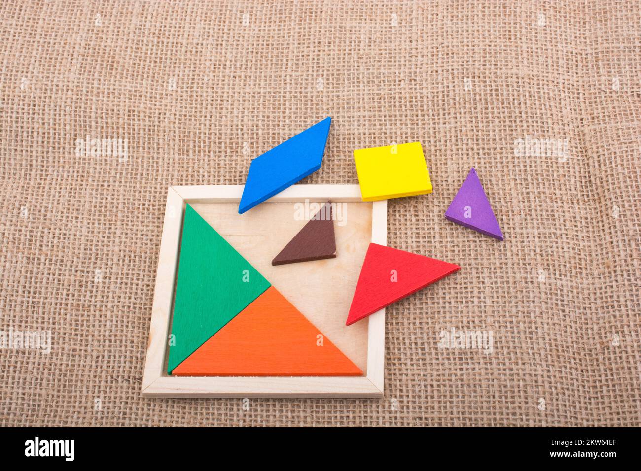 Colorful pieces of a square tangram puzzle Stock Photo - Alamy