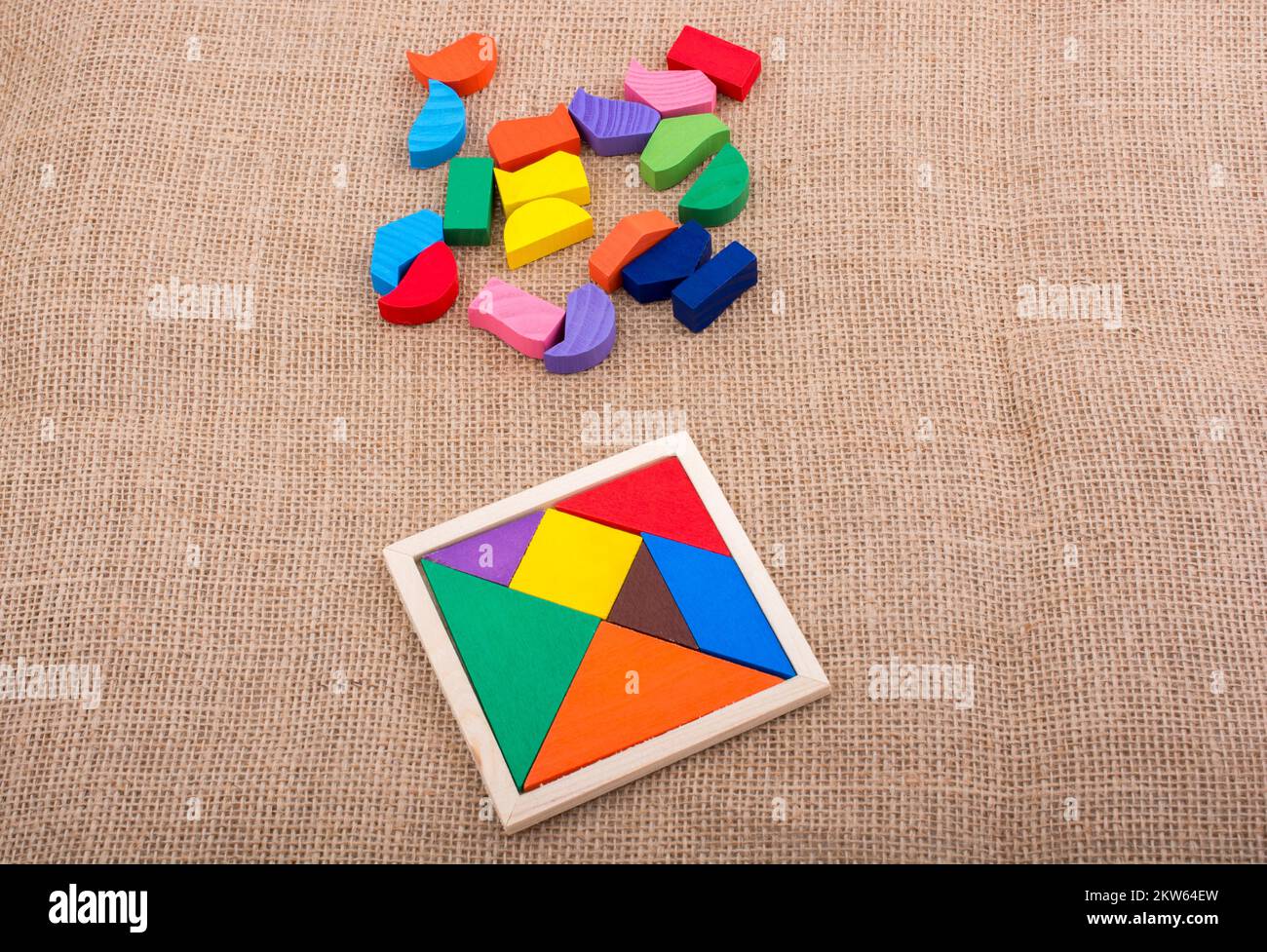 Colorful pieces of a square tangram puzzle Stock Photo - Alamy