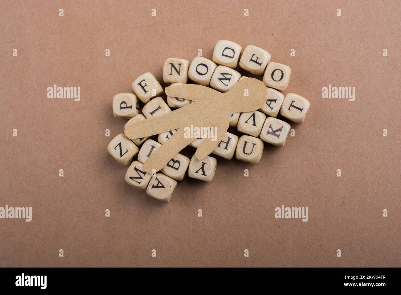 Paper man and letter cubes of made of wood Stock Photo - Alamy
