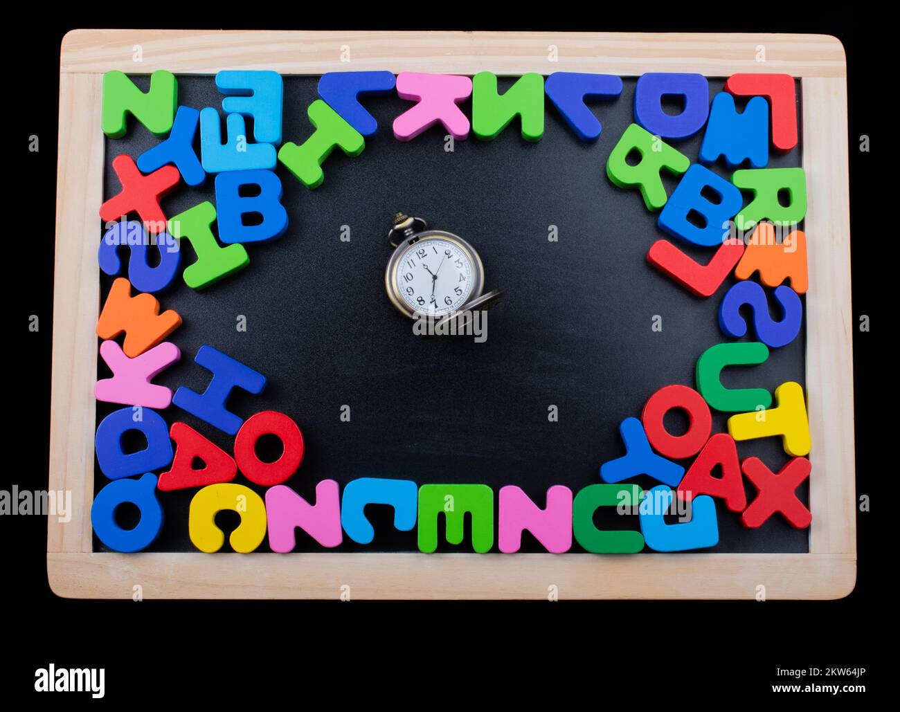 Pocket watch and colorful Letters of Alphabet made of wood Stock Photo ...