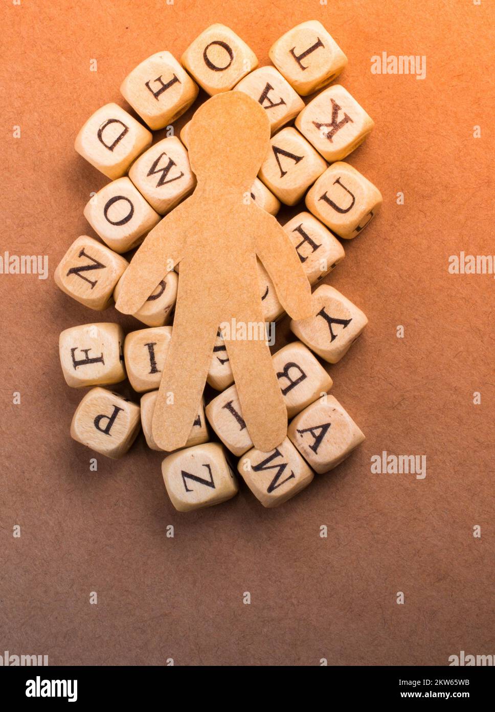Paper man and letter cubes of made of wood Stock Photo - Alamy